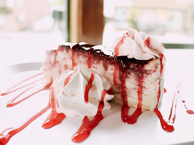 This raspberry cheesecake doesn't just flirt with perfection&mdash;it's in a committed relationship. The whipped cream is just showing off.