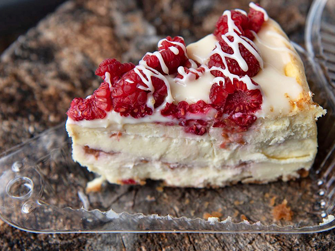 A raspberry cheesecake that's dressed for success. Those perfect berries on top are like little red jewels that make you feel fancy even as you contemplate licking the plate.