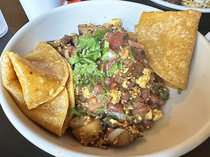 The Renegade breaks all breakfast rules with its rebellious mix of scrambled tofu, potatoes, and beans. It's the morning equivalent of wearing sunglasses indoors.