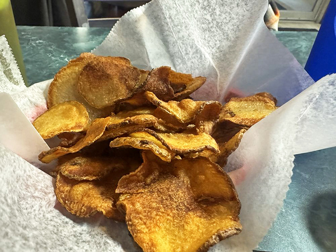 These aren't just potato chips&mdash;they're house-made slices of golden perfection that shatter satisfyingly between your teeth, spoiling you for the bagged variety forever.