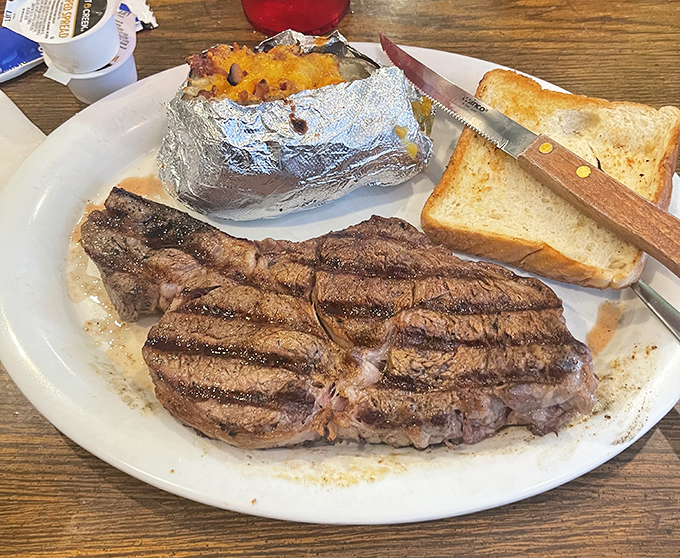 A perfectly grilled ribeye with that beautiful char that whispers, "Yes, this is exactly what you drove an hour for."