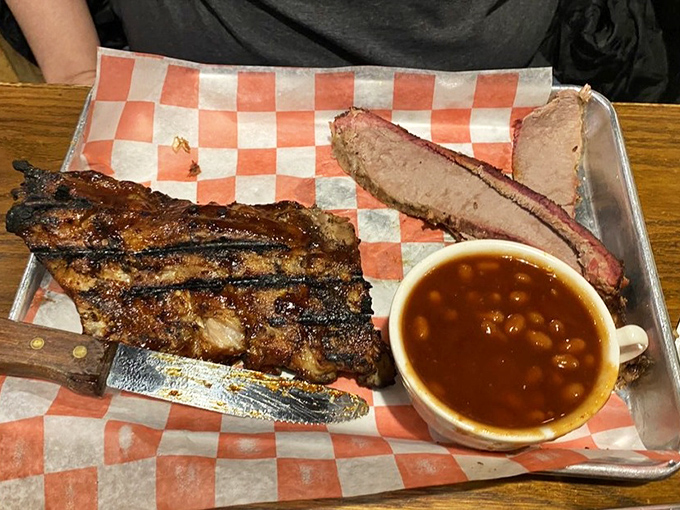 Ribs with bark so perfect they could make a vegetarian question their life choices, alongside brisket that whispers smoky secrets.