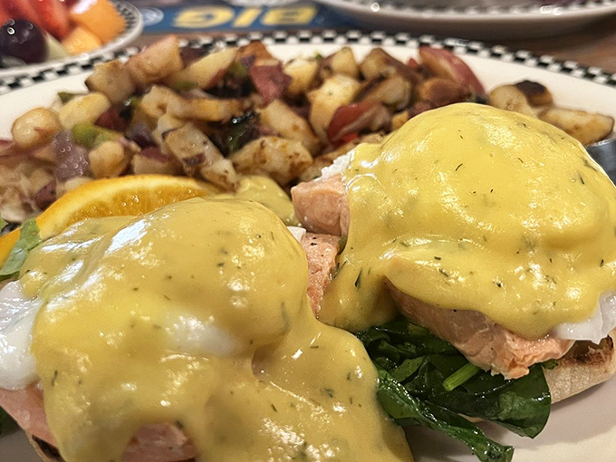Eggs Benedict gets the coastal treatment with perfectly poached eggs and hollandaise cascading over salmon like a sunrise over the Sierra Nevada.