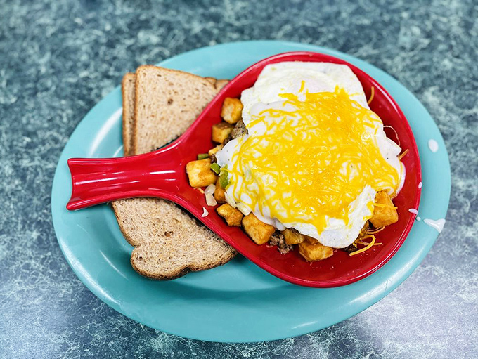 Breakfast alchemy at its finest: potatoes, eggs, cheese, and magic, served in a skillet that could tell stories if it could talk.
