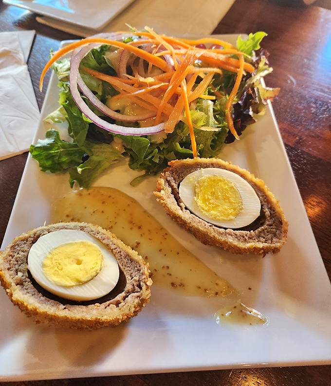 Scotch eggs that would make a Glaswegian grandmother weep with joy, paired with a salad to pretend you're making healthy choices.