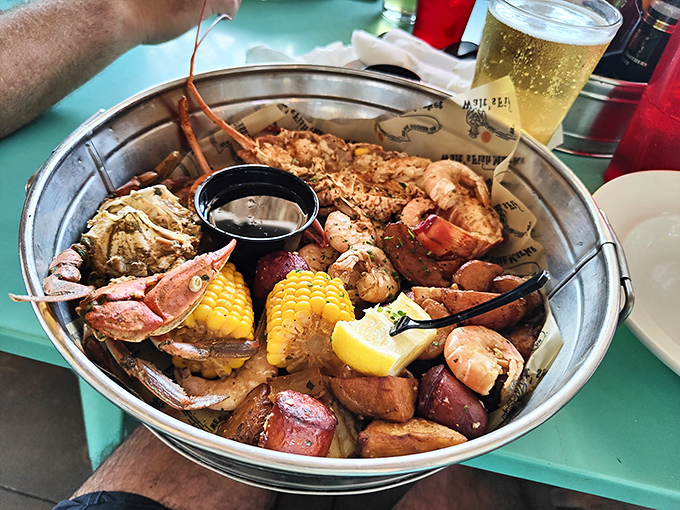 The seafood boil arrives like buried treasure in a metal bucket&mdash;corn, potatoes, and sea creatures having the world's most delicious party. 