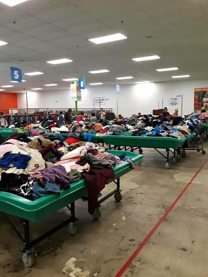 The universal language of thrifting: everyone bent over bins, united in the hunt for gold.