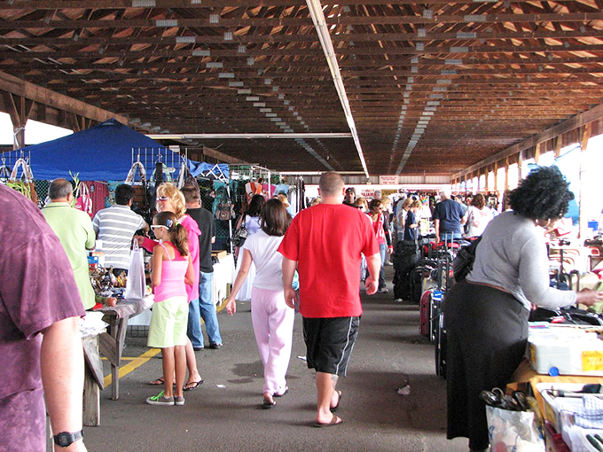 Shoppers browse under the covered outdoor section. The red roof doesn't just provide shade&mdash;it's a beacon for bargain hunters visible from three counties away.
