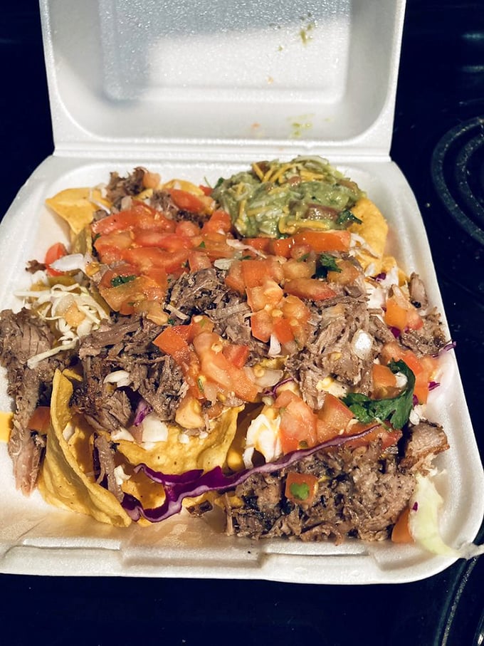 The styrofoam container barely contains the explosion of colors and textures &ndash; a portable party of shredded beef and fresh toppings.