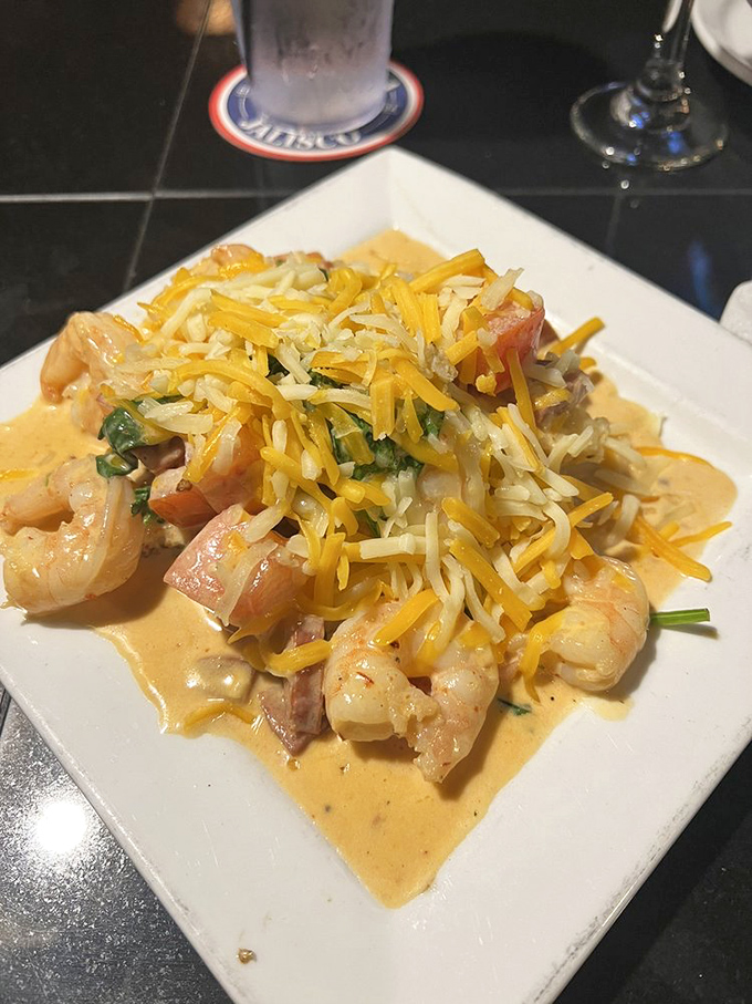 Shrimp and grits elevated to an art form&mdash;where cheese pulls rank and creamy sauce demands to be sopped up.