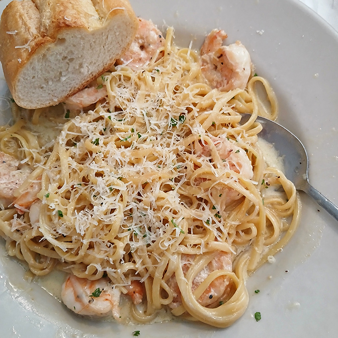 Shrimp scampi pasta that's unapologetically simple and utterly perfect. The generous dusting of Parmesan is the snow-capped mountain these tender pink shrimp call home. 