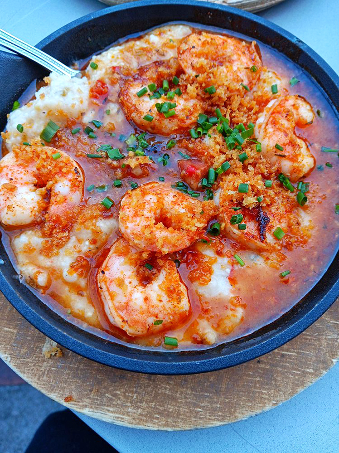 Shrimp and grits elevated to an art form. Those plump shrimp swimming in savory goodness atop creamy grits is the South in a skillet.