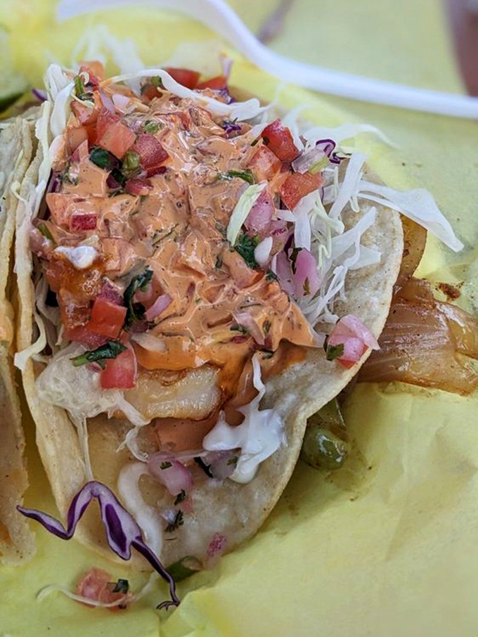 The ocean's finest treasure nestled in a tortilla. This shrimp taco, adorned with vibrant sauce and fresh toppings, is coastal Mexico in one bite.