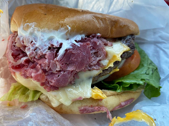Not just any burger&mdash;a Slyman's burger. Where beef meets destiny on a bun, with cheese playing matchmaker and lettuce adding a whisper of virtue.