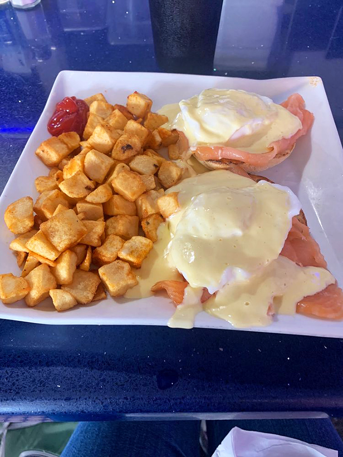 Eggs benedict with salmon: proof that sometimes the best things in life come stacked on an English muffin and smothered in hollandaise sauce.