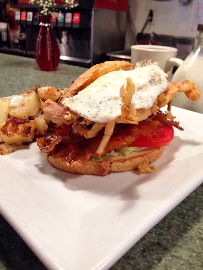 The architectural marvel that is this sandwich&mdash;crispy bacon, fresh tomato, and what appears to be soft-shell crab, all crowned with a perfectly fried egg.