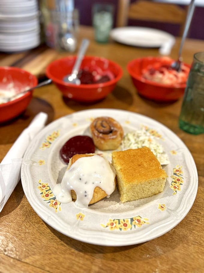 Cornbread, biscuits, and sweet treats arranged like a still-life painting titled "Why Elastic Waistbands Were Invented."