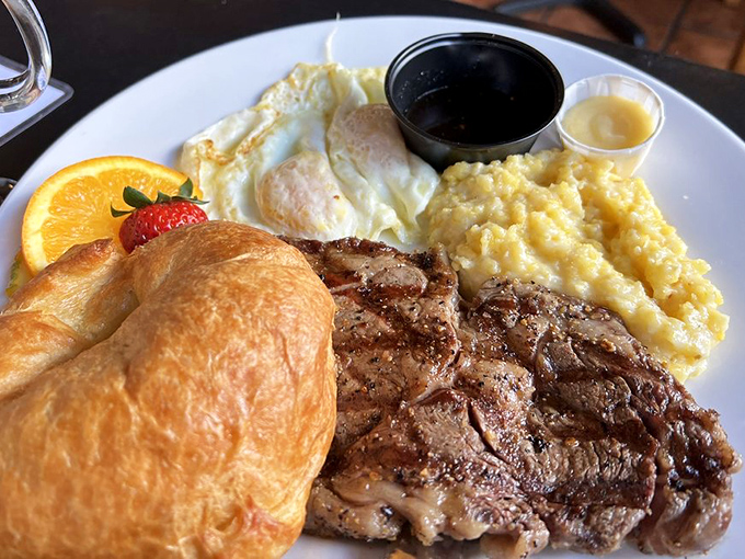 When steak meets eggs, it's not just breakfast, it's a celebration. That croissant looks like it might float away if not for the gravity of deliciousness.