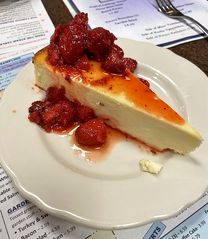 New York cheesecake crowned with strawberry compote &ndash; dense, creamy, and rich enough to make you contemplate moving to Connecticut permanently.