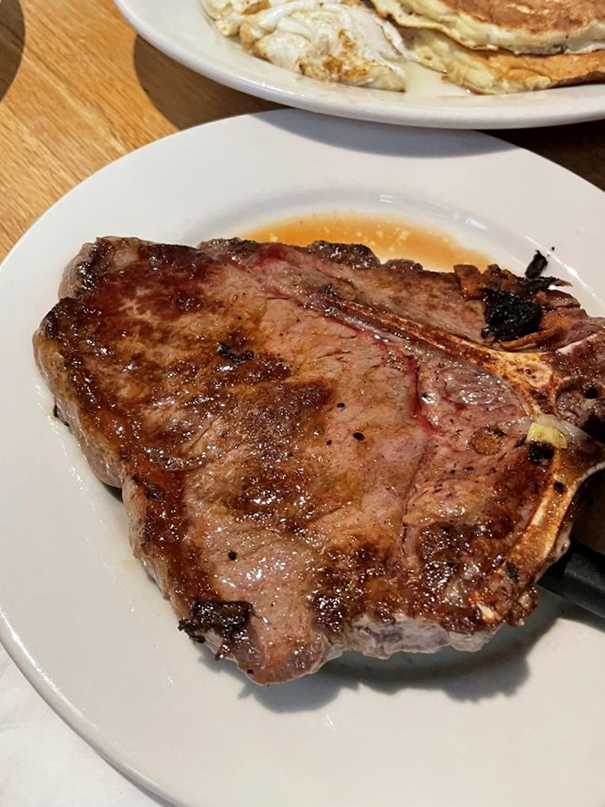 This T-bone steak isn't messing around. It's the kind of cut that makes vegetarians momentarily question their life choices.