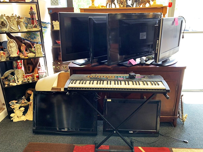 The electronics section spans decades of technology, from vintage keyboards to modern TVs, all waiting for new homes.