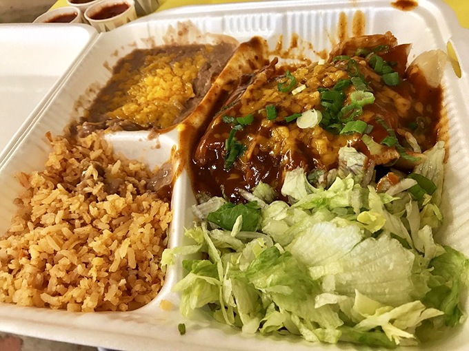 Homemade tortillas steal the spotlight, resting on humble paper like sculptures that happen to be deliciously edible.