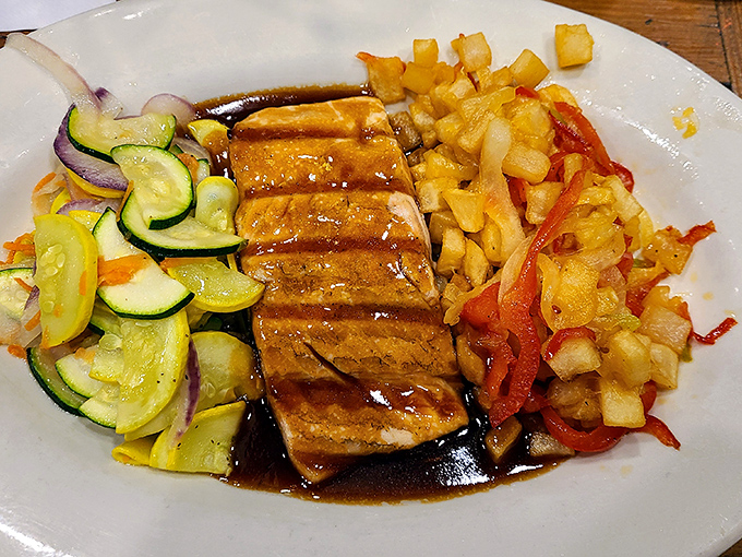 Salmon that's traveled less distance than you did to get here, glazed to perfection and surrounded by vegetables that actually make you want to eat them.