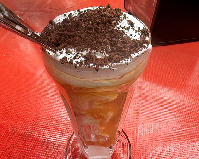 Meet The Jigger&mdash;the sundae that launched a thousand pilgrimages. Chocolate crumbles atop vanilla ice cream with that mysterious, magical sauce.