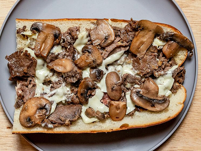 Mushrooms and cheese melt together in perfect harmony, like a culinary duet that's been practicing for decades.