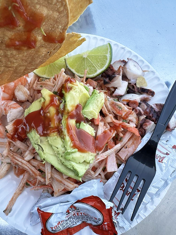 This mixed seafood tostada with avocado looks like California itself decided to throw a party on a crispy tortilla.
