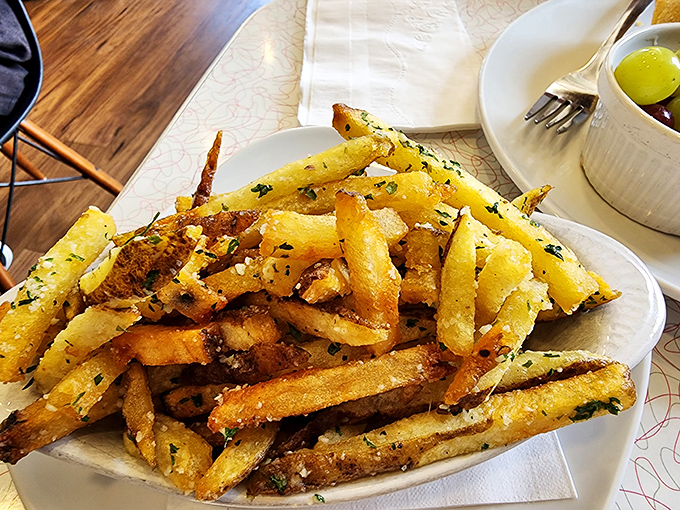 Truffle fries that make regular fries seem like they're not even trying. The herbs aren't garnish&mdash;they're essential supporting actors in this potato drama.