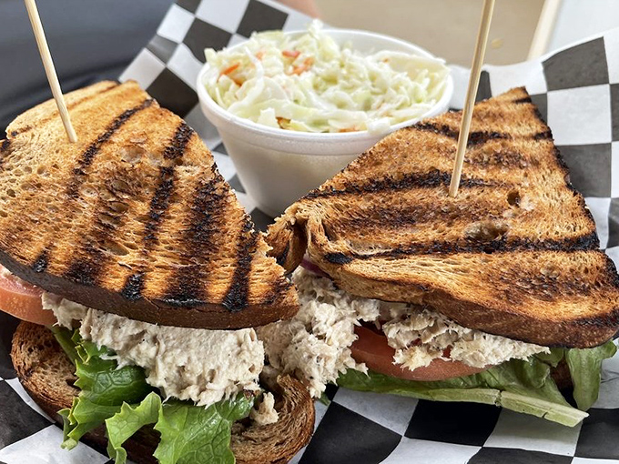 A sandwich that doesn't need to shout to be heard. Perfectly grilled bread, generous filling, and that homemade coleslaw sidekick&mdash;lunch perfection achieved.