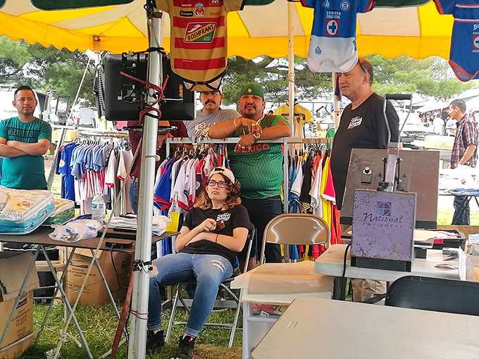 A family affair - vendors chat while displaying their wares, creating that community atmosphere that makes flea markets special.