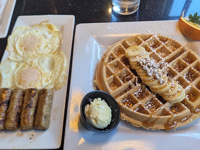 The breakfast holy trinity—golden waffle, sunny eggs, and sausage links—proof that sometimes the classics need no improvement.