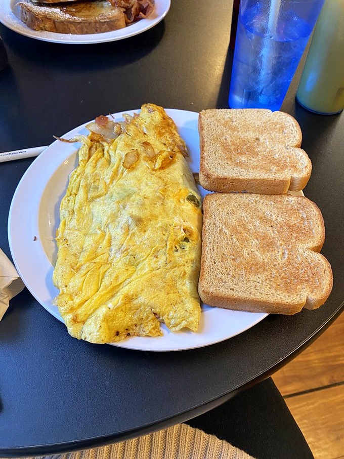 An omelet shouldn't be a shy, delicate thing. It should announce itself with authority, like this golden masterpiece that's practically bursting with fillings.