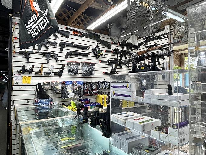 The peace-through-superior-firepower booth, where airsoft enthusiasts can gear up for weekend warriors' adventures without explaining anything to their spouses.