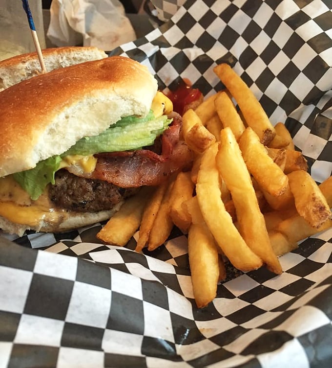 A burger that requires a game plan before the first bite. Notice how the cheese melts just right&mdash;that's not an accident, folks.