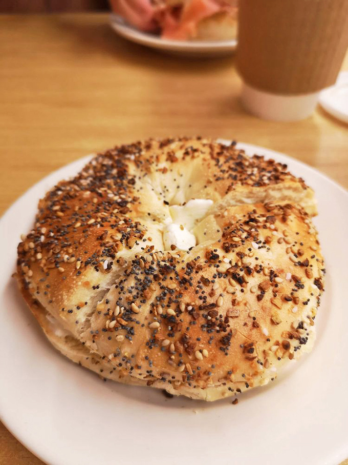 This isn't just any bagel &ndash; it's a New York bagel with enough seeds to start a garden and enough chew to remind you you're alive.