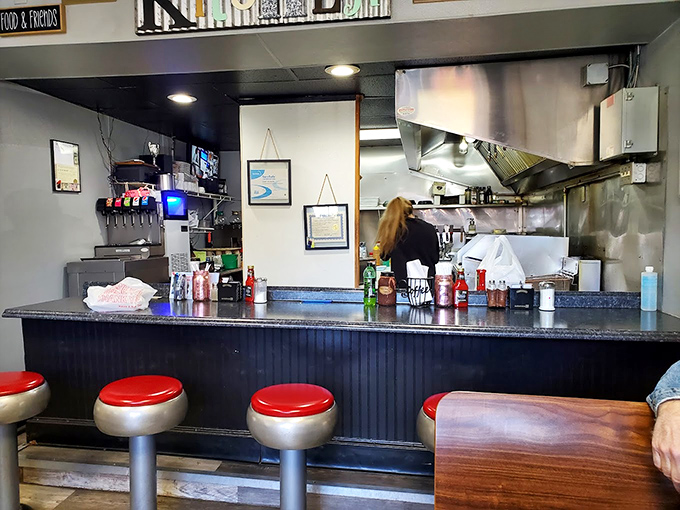 The counter seating offers front-row tickets to the breakfast theater &ndash; where coffee refills flow and bacon sizzles with Broadway-worthy timing.