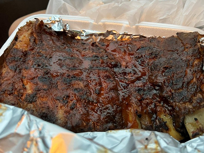These ribs showcase the beautiful bark and perfect smoke ring that separates real barbecue from mere pretenders.