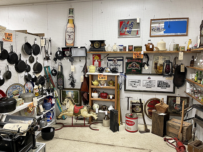 This vendor booth is what happens when someone with excellent taste inherits their grandparents' attic and decides to share. That "Gotham Electric Hot Rod" sign belongs in my den.