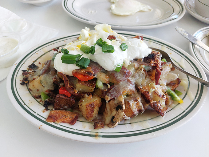 Hashbrowns loaded with enough toppings to qualify as their own food group. The poached eggs on top create nature's perfect sauce.
