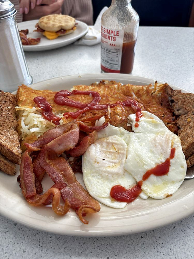 Breakfast harmony achieved &ndash; crispy bacon, perfectly fried eggs, and toast ready to soak up every last bit of yolk-y goodness.