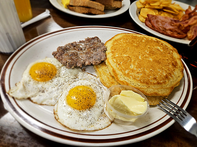 Breakfast perfection isn't complicated: two sunny eggs, scrapple that would convert any skeptic, and pancakes so fluffy they practically hover above the plate.
