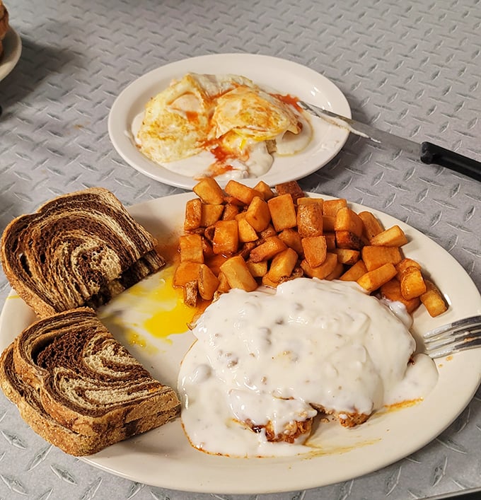 Breakfast potatoes with country-fried steak and gravy&mdash;the kind of meal that makes you want to cancel your other meals for the day.