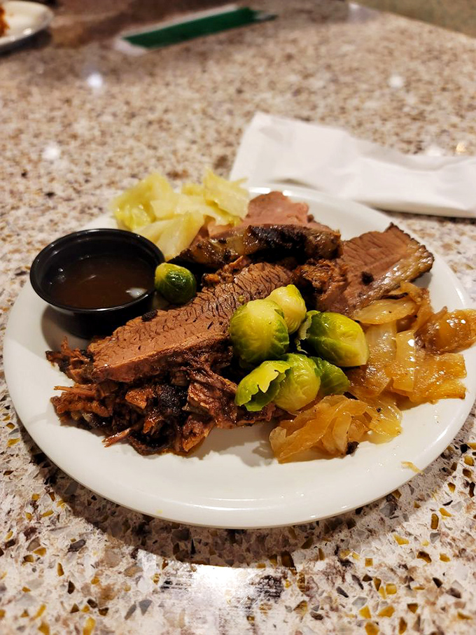 A plate that tells the story of American comfort food—tender brisket alongside vibrant Brussels sprouts proves vegetables can be more than an obligation.