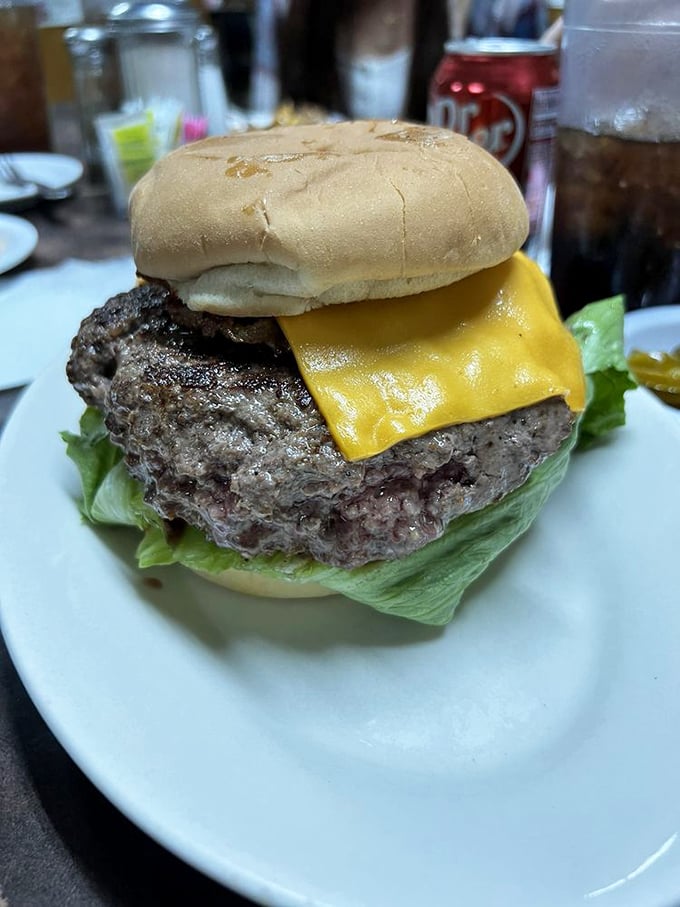 This isn't just a burger; it's a testament to Texas-sized appetites, with a beef patty so substantial it makes the bun look like it's playing dress-up.