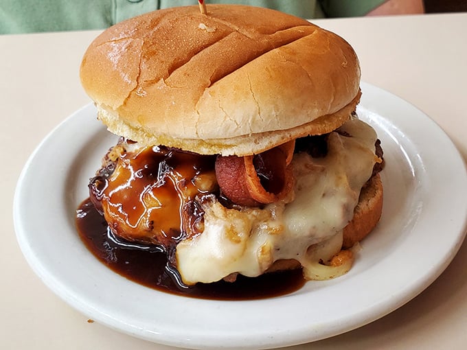 Not just a burger&mdash;a masterpiece of melty cheese, savory sauce, and bacon that makes fast-food chains weep with inadequacy. Worth every napkin you'll need.