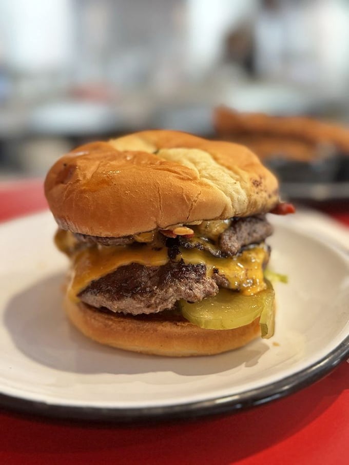 Behold the double cheeseburger in its natural habitat—juicy, melty, and completely unapologetic about how good it's going to make you feel.