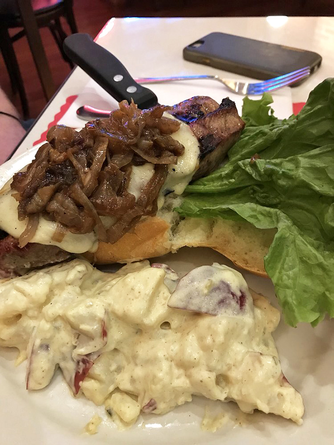 When a burger comes with caramelized onions and potato salad this good, you'll find yourself planning your next visit before finishing the first bite.